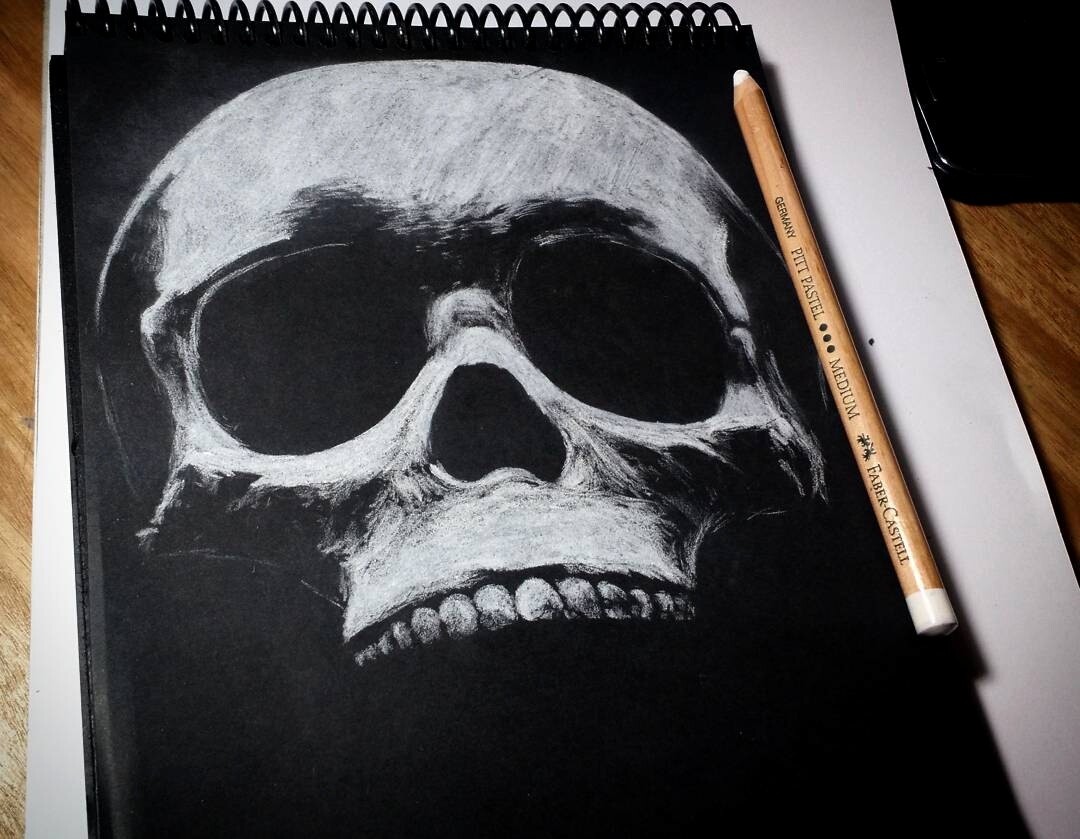 how to draw a skull on black paper