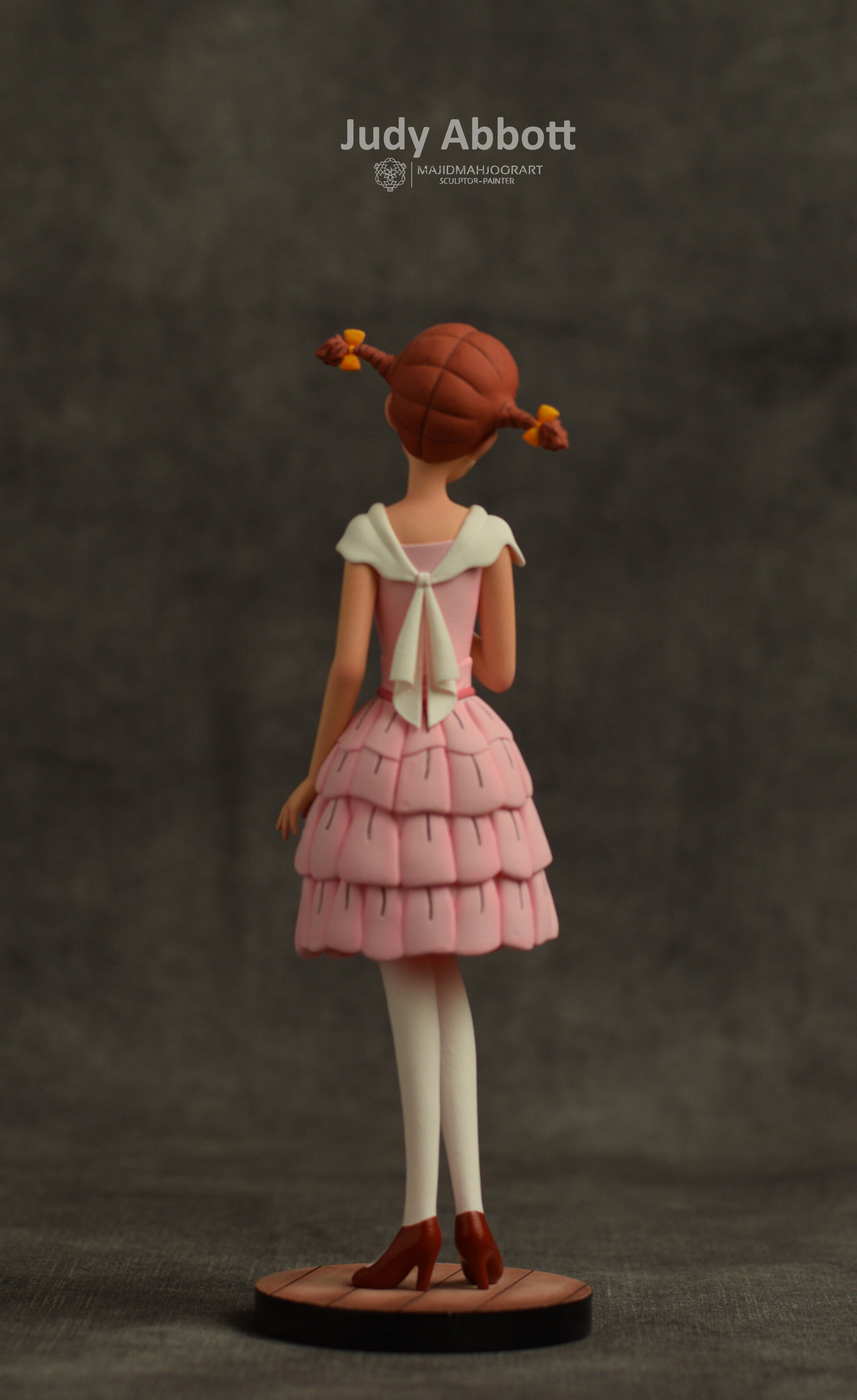 Majid Mahjoor - Judy Abbott in her school's welcome party pink dress