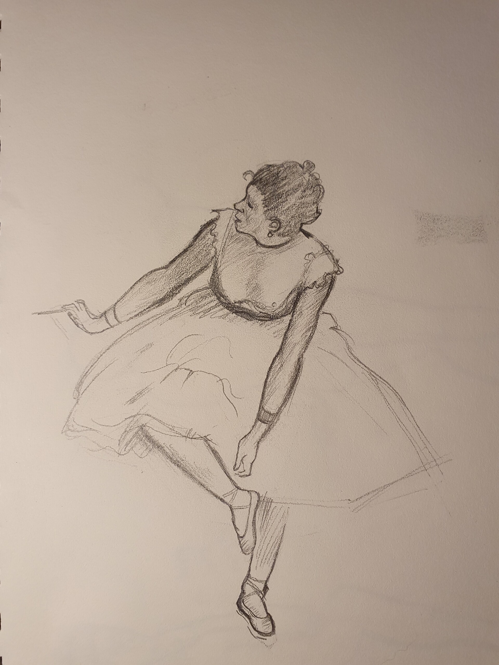 dancer adjusting her slipper